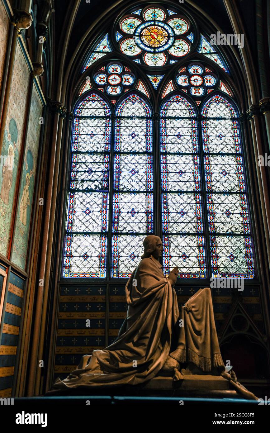 Praying Statue and Stained Glass in Notre Dame Cathedral - Paris ...
