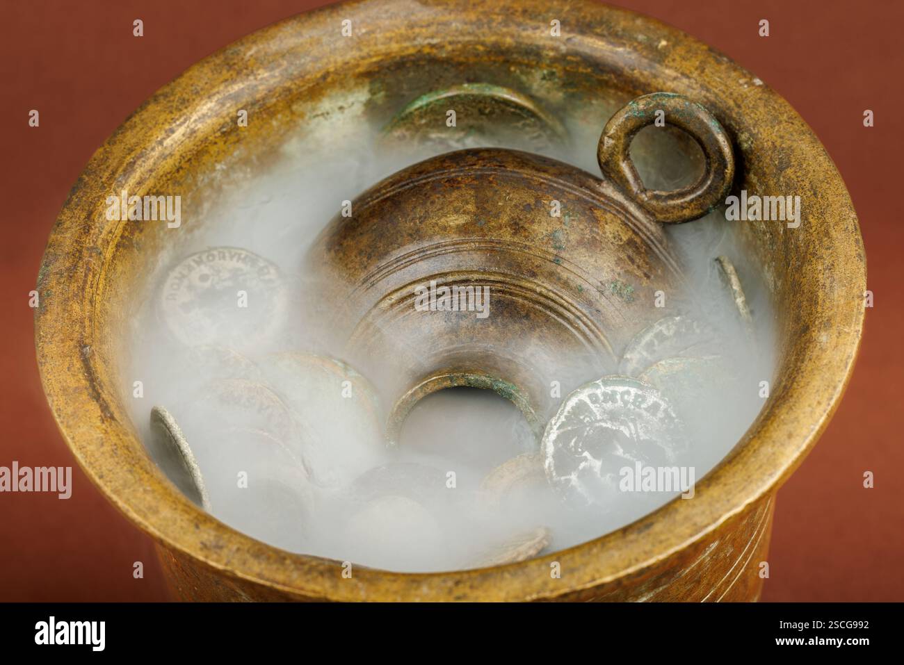 Ancient treasure pot with aged coins, partially covered in mysterious ...