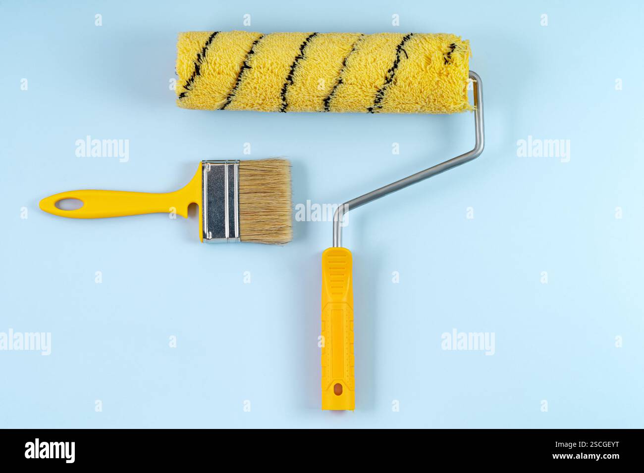 Yellow building roller for wall painting, brush, individual housing ...