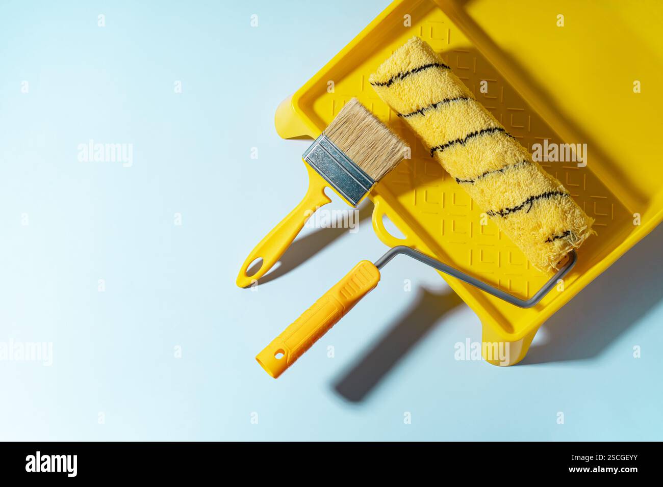 Yellow building roller for wall painting, brush, individual housing ...