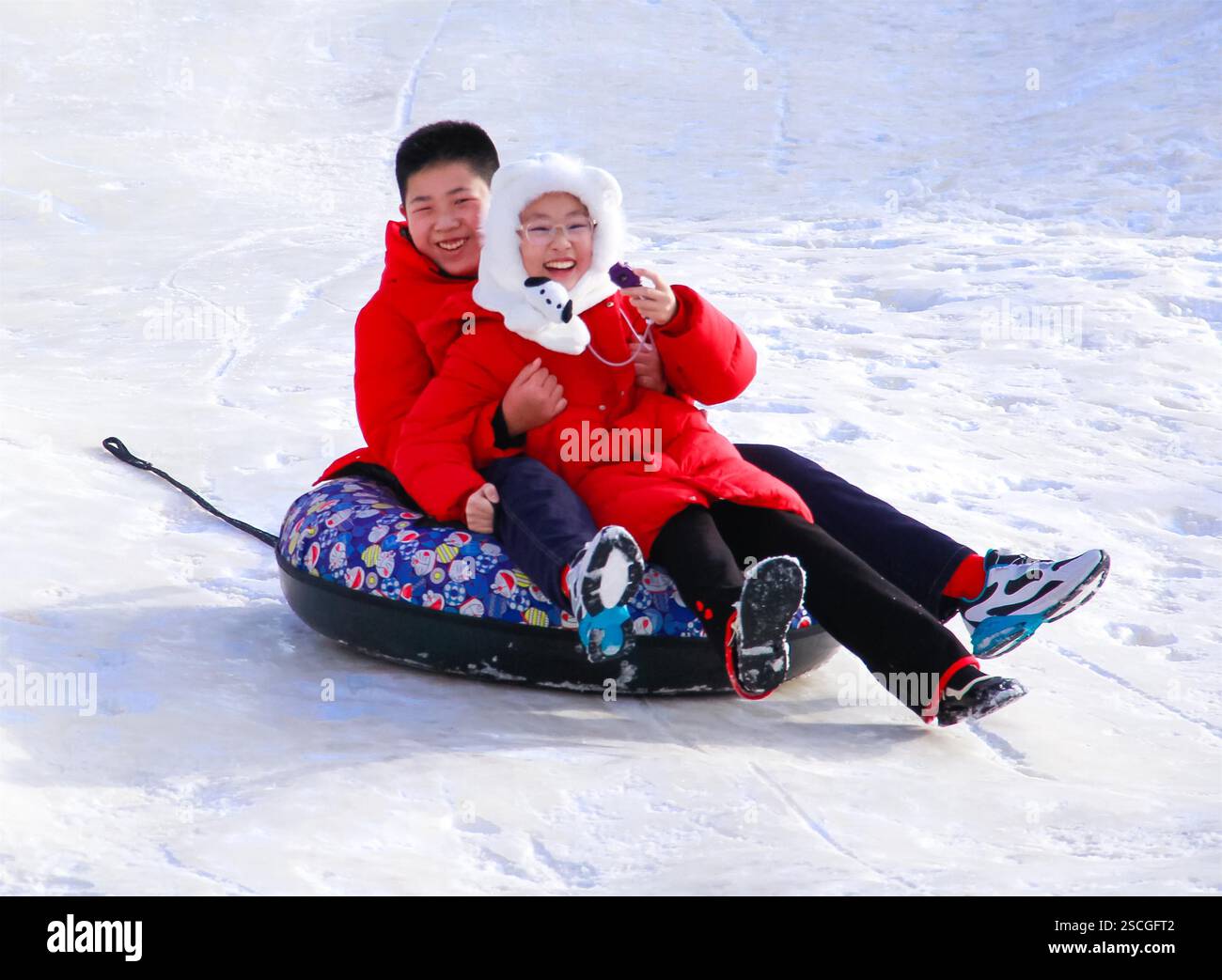 Tourists enjoy snow fun in Dunhuang City, northwest China's Gansu ...