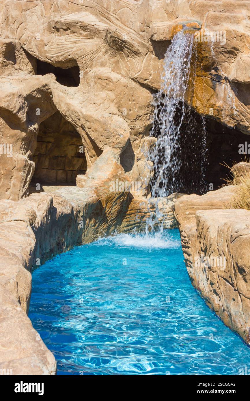 Waterfall in the pool at the hotel Stock Photo - Alamy