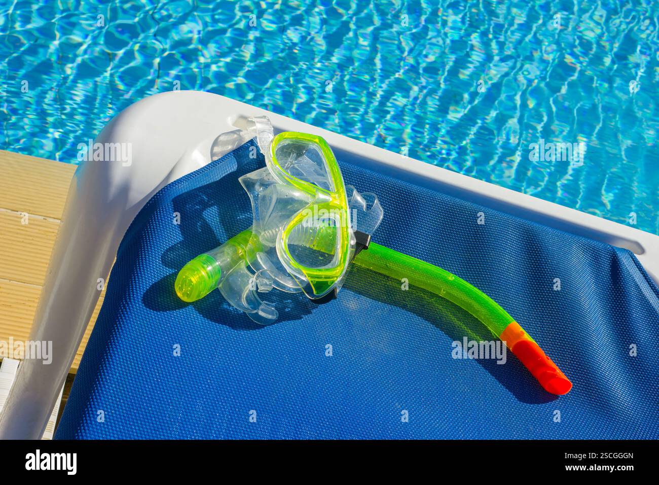 Mask and snorkel for diving near the swimming pool Stock Photo - Alamy
