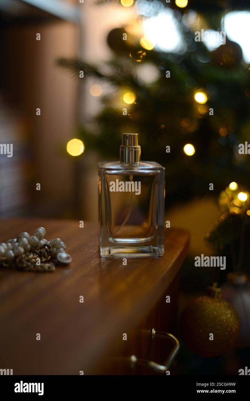perfume bottle by a christmas tree Stock Photo - Alamy