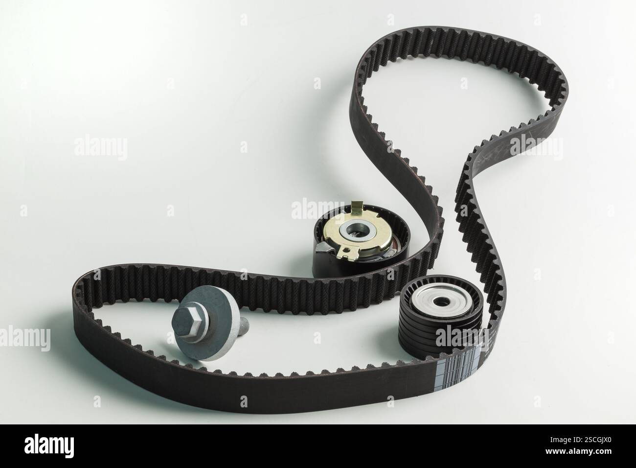 Image of timing belt with rollers on a white background Stock Photo - Alamy