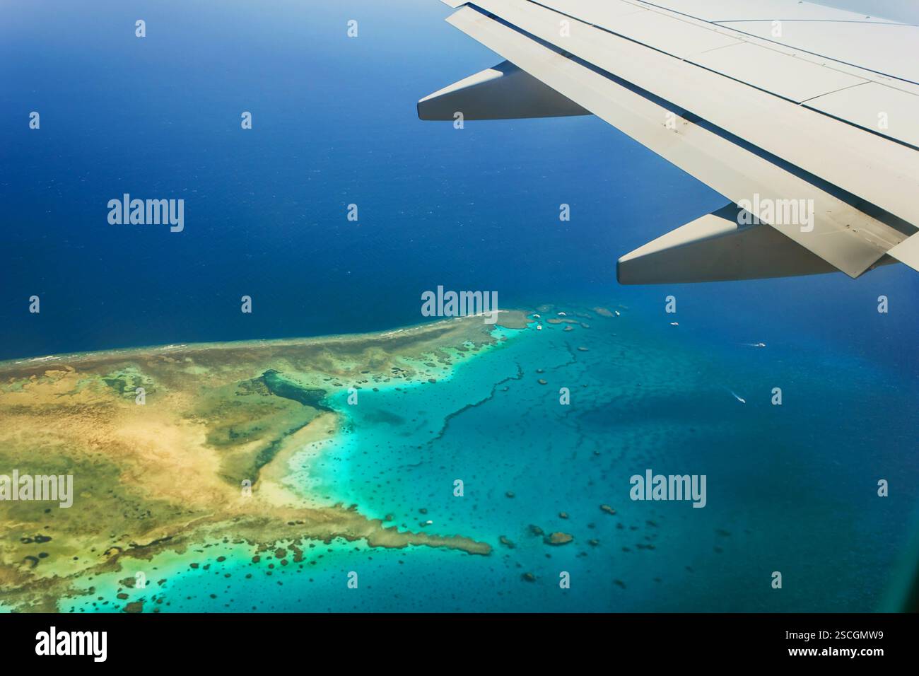 View from a plane window on the wing and the landscape below it Stock ...
