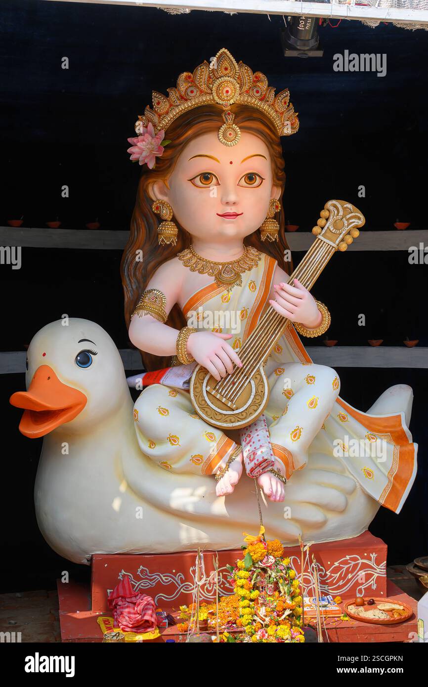 Idol of Goddess Devi Saraswati at a decorated puja pandal in Kolkata ...