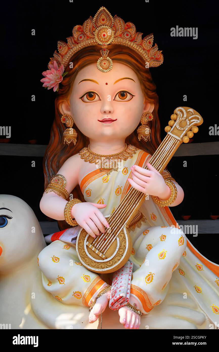 Idol of Goddess Devi Saraswati at a decorated puja pandal in Kolkata ...
