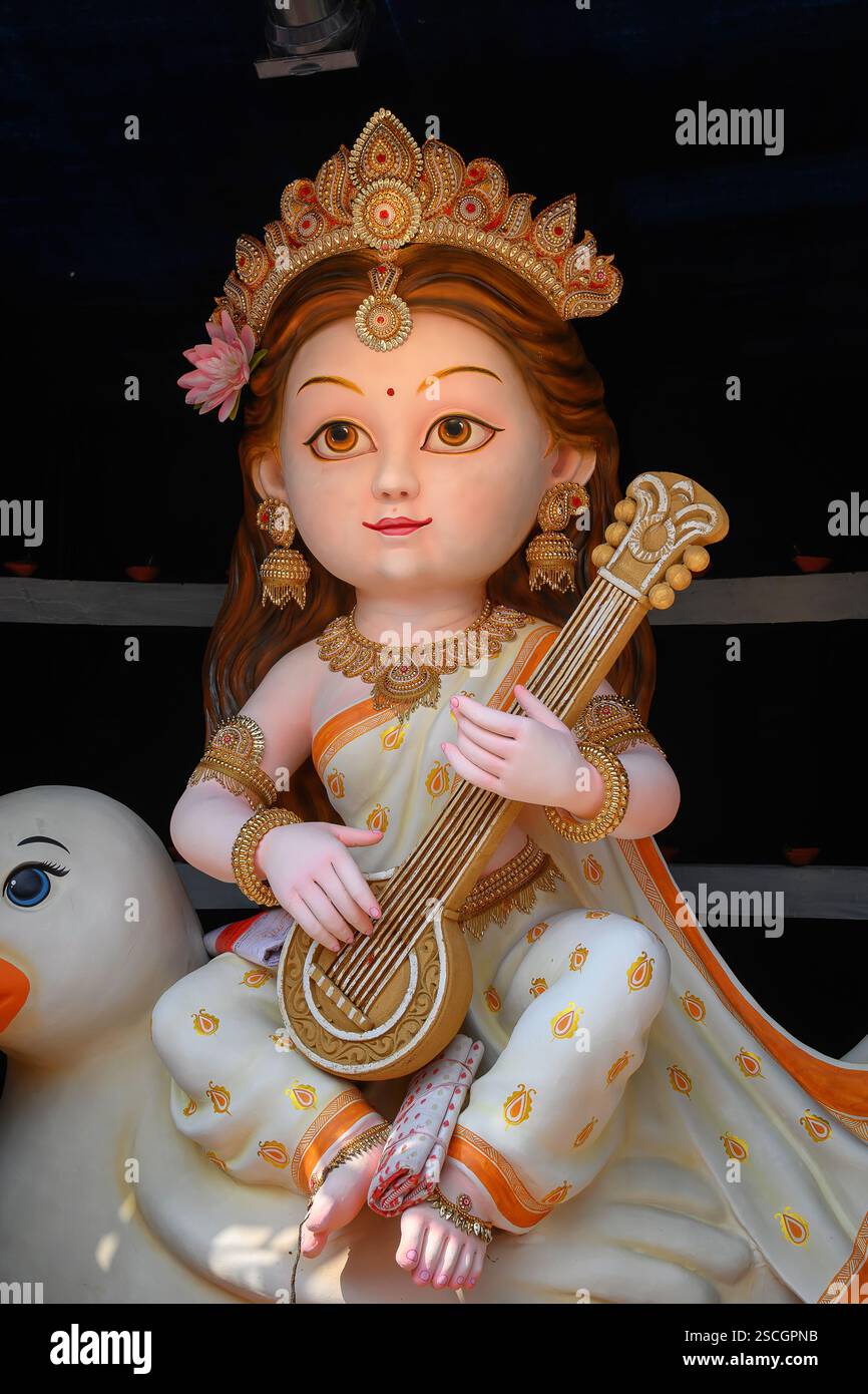 Idol of Goddess Devi Saraswati at a decorated puja pandal in Kolkata ...