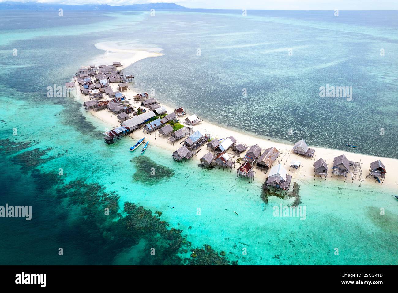 Traditional village of bajau laut people on a small sandy tropical ...