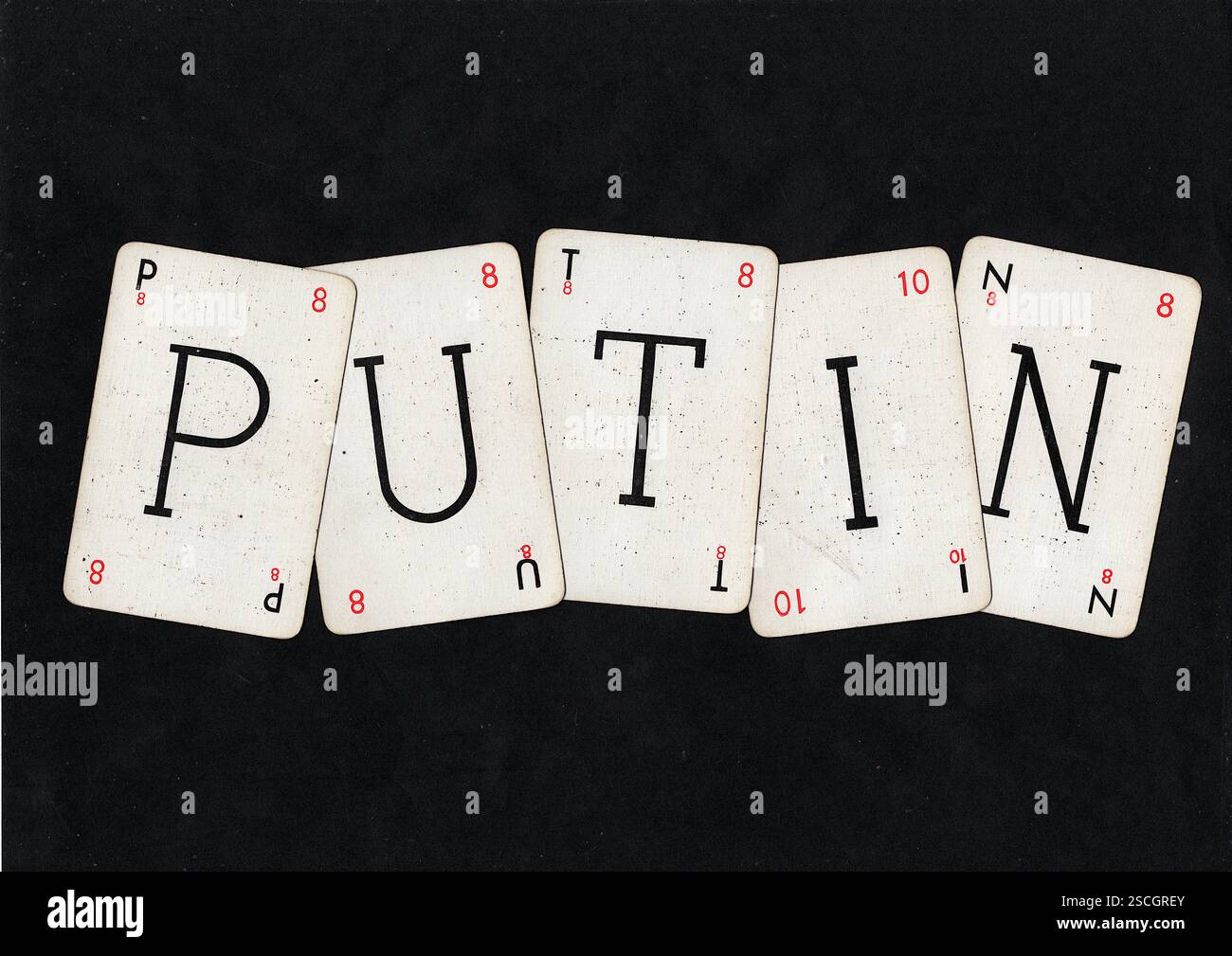 Vintage word game playing cards spelling PUTIN isolated on a black ...