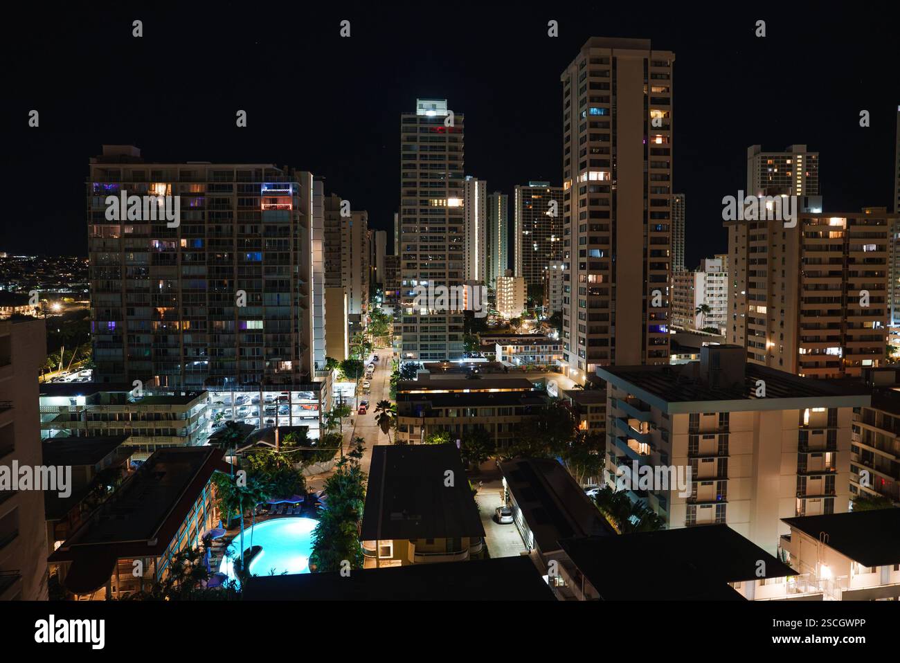 Nighttime Cityscape of Honolulu with Illuminated Buildings and Pool ...