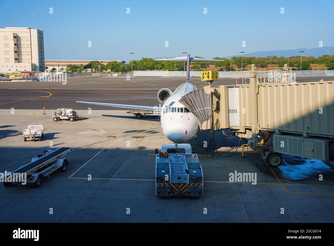 Commercial Airplane at Gate A14 with Mountains in the Background Stock ...