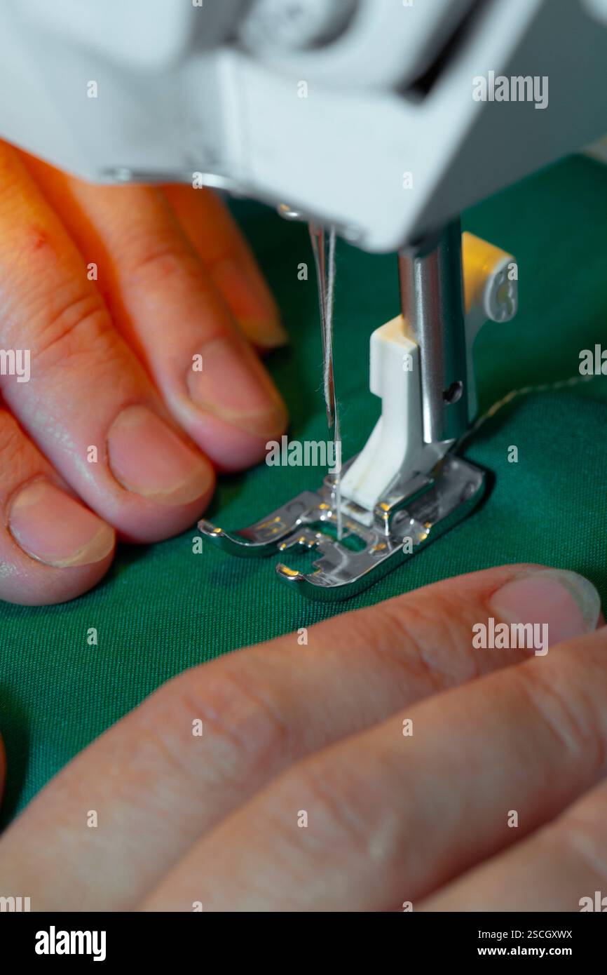 The sewing machine and item of clothing Stock Photo - Alamy