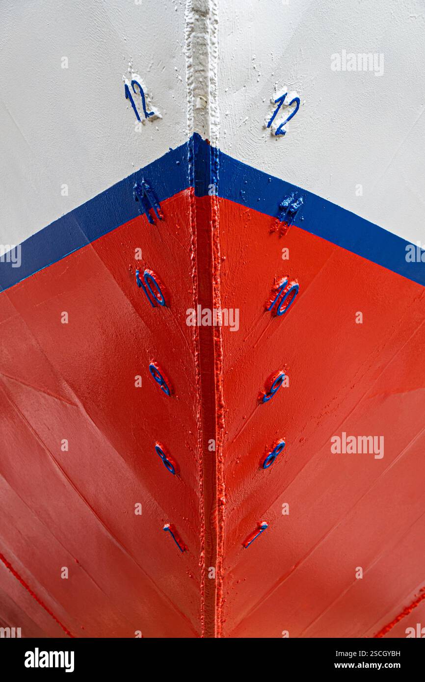 Ship's bow with red, white, and blue paint, featuring blue draft ...