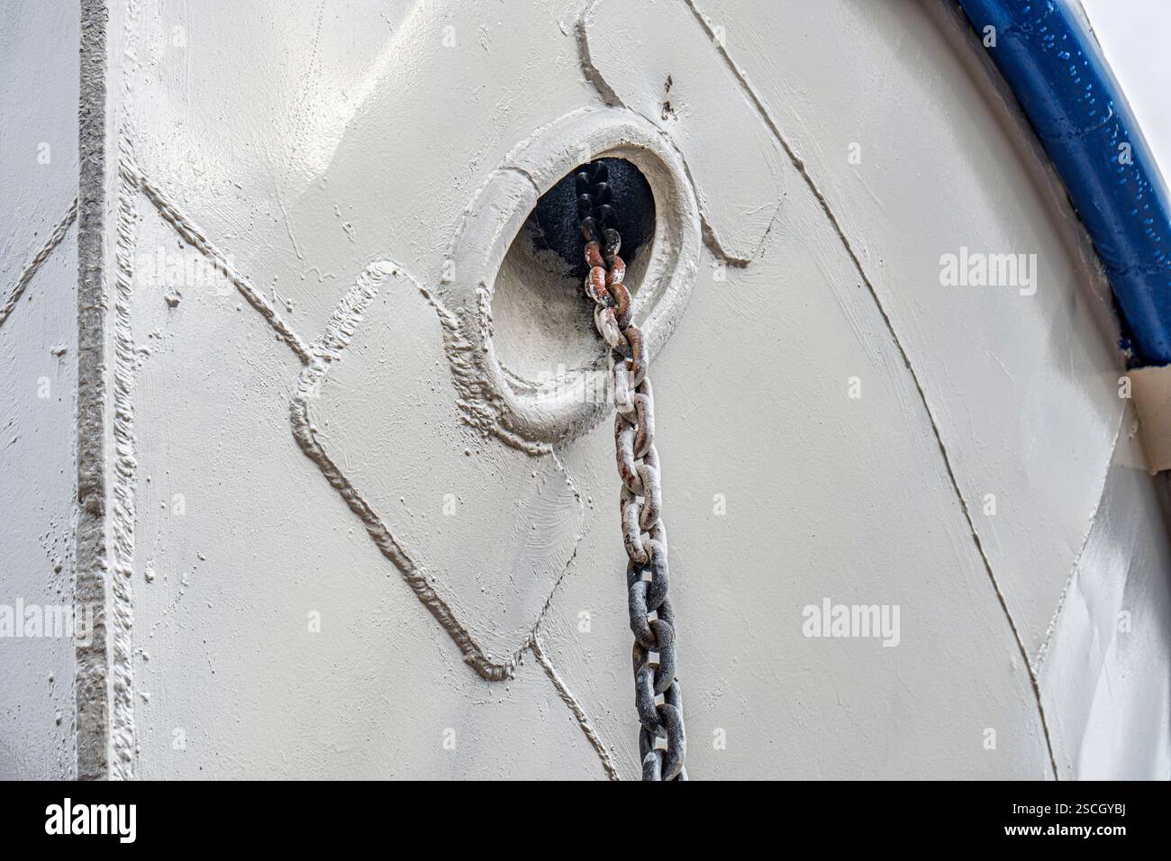 Ship's bow with anchor chains extending from the hawse holes, featuring ...