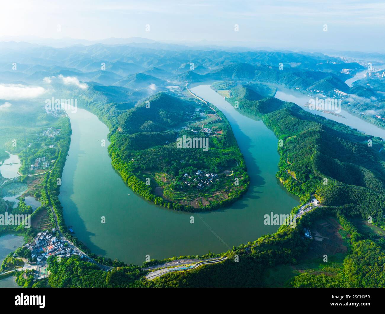 Aerial View of a River Meandering Through Lush Green Hills Stock Photo ...