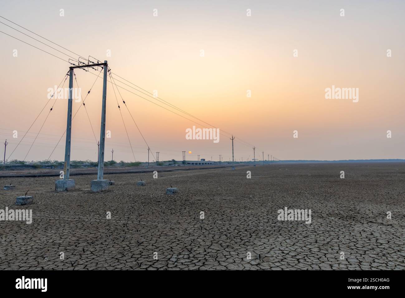 dry farm fields with sunrise bright orange sky at morning Stock Photo ...