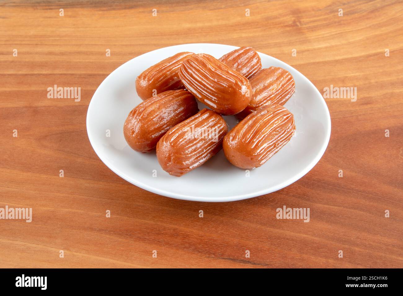 Traditional Turkish dessert Tulumba on a plate. Tulumba dessert is ...