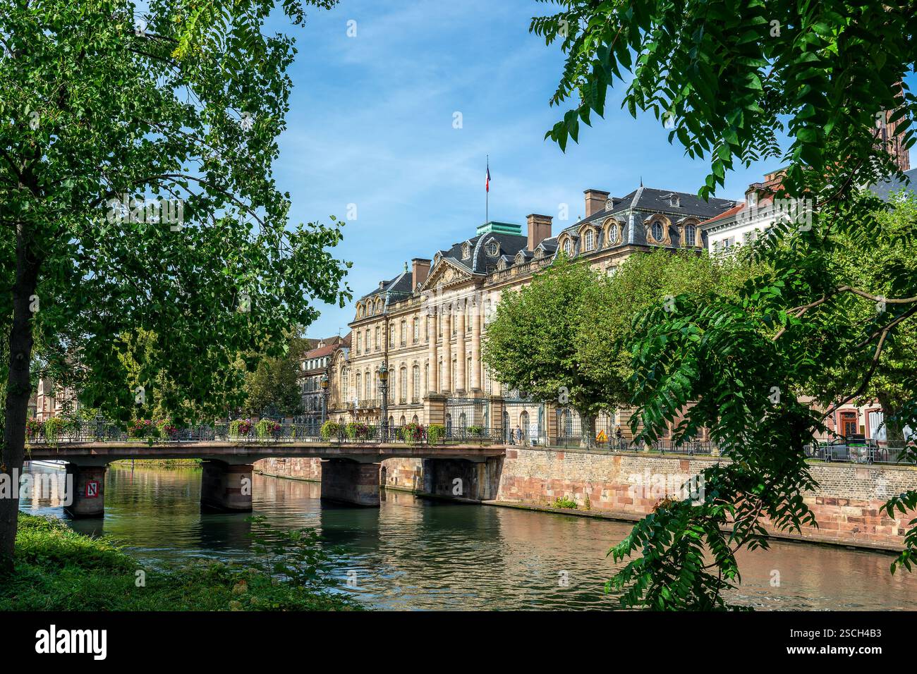 Pedestrian footbridge on Ill river and Palais Rohan (Rohan palace) in ...