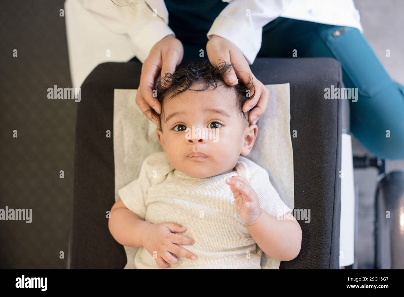 Lady doctor baby checking clinic hi-res stock photography and images ...