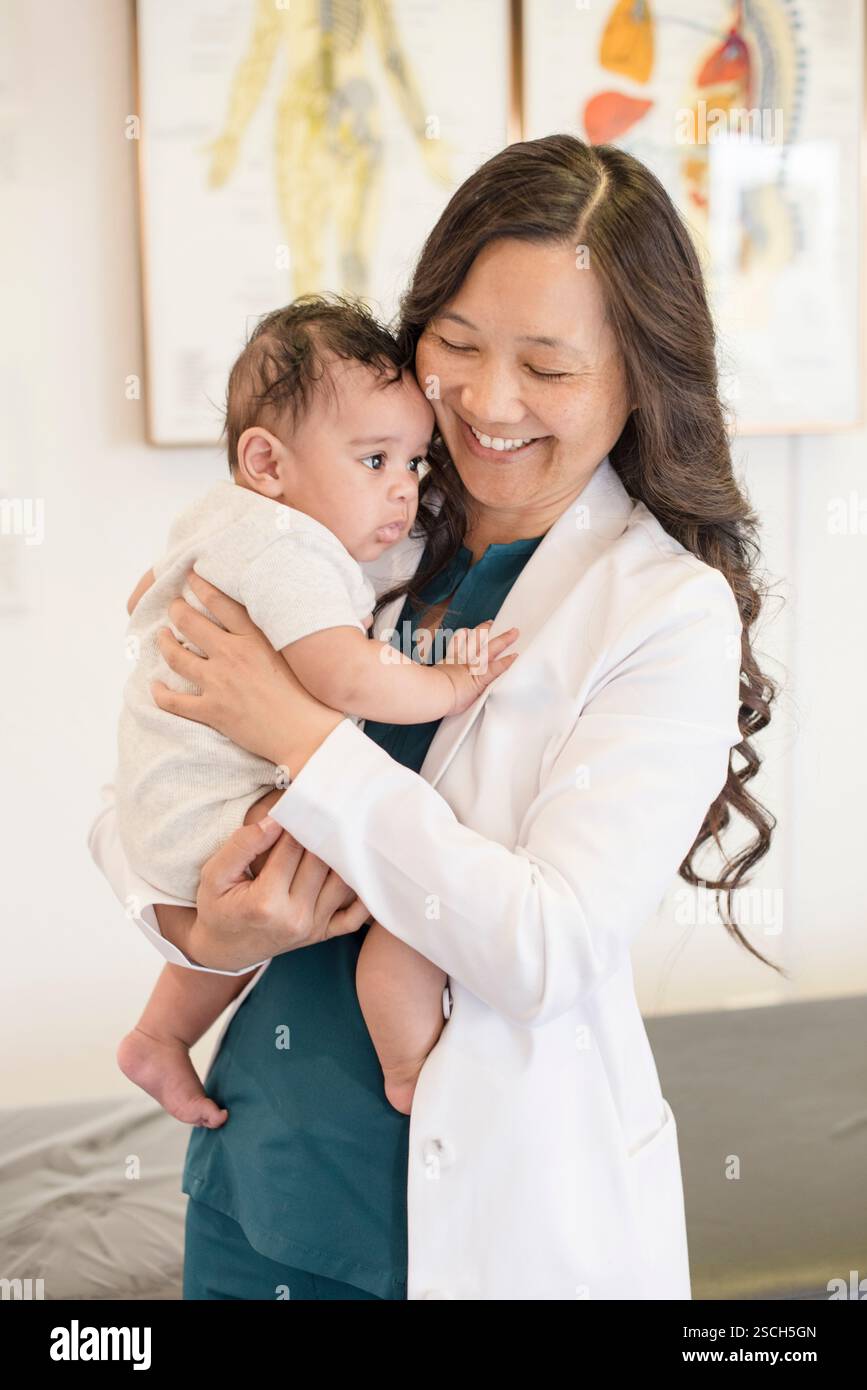 Female doctor holding caring hi-res stock photography and images - Alamy