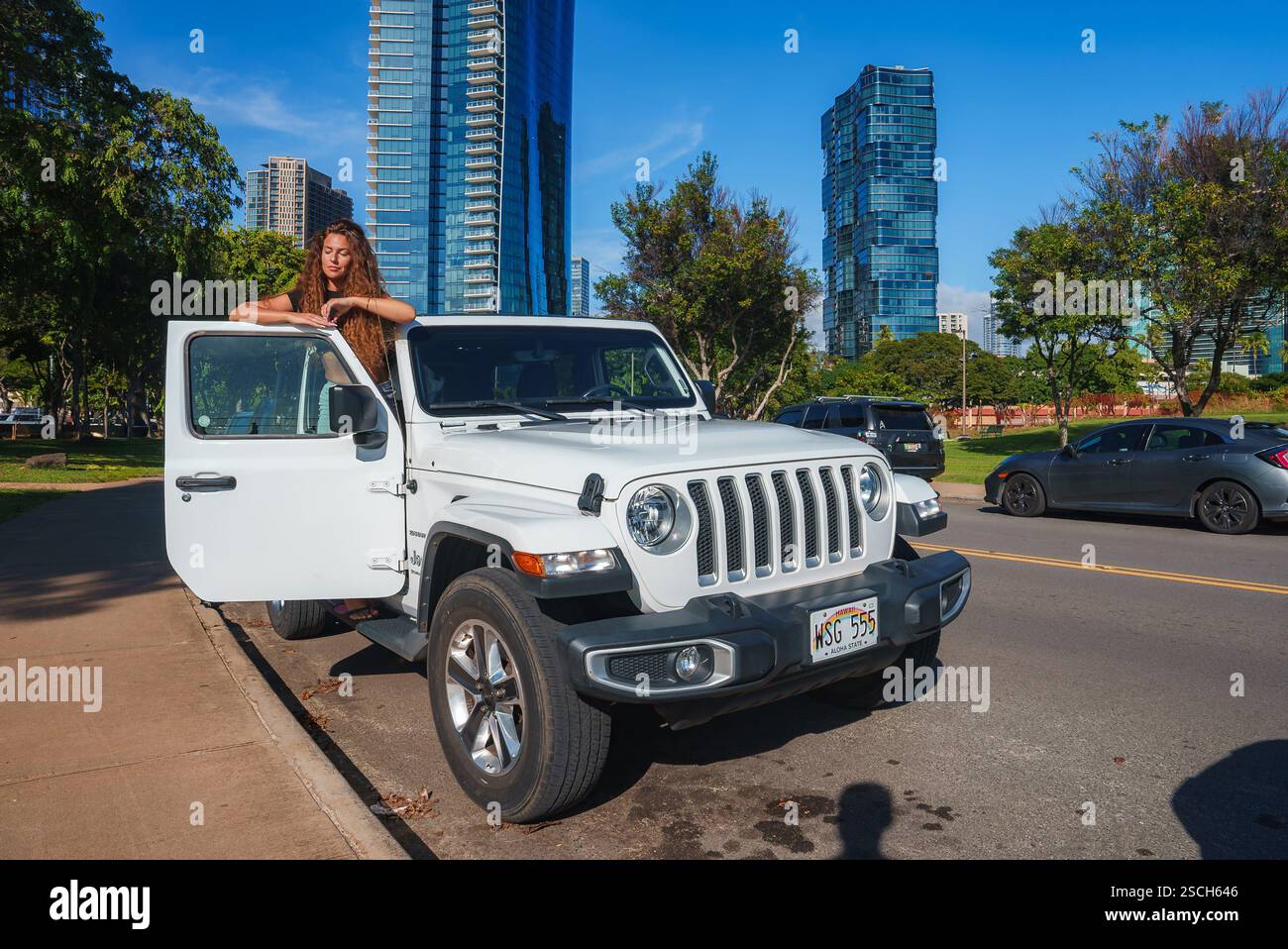 White Jeep Wrangler Parked by Road with Urban Skyline in Hawaii Stock ...