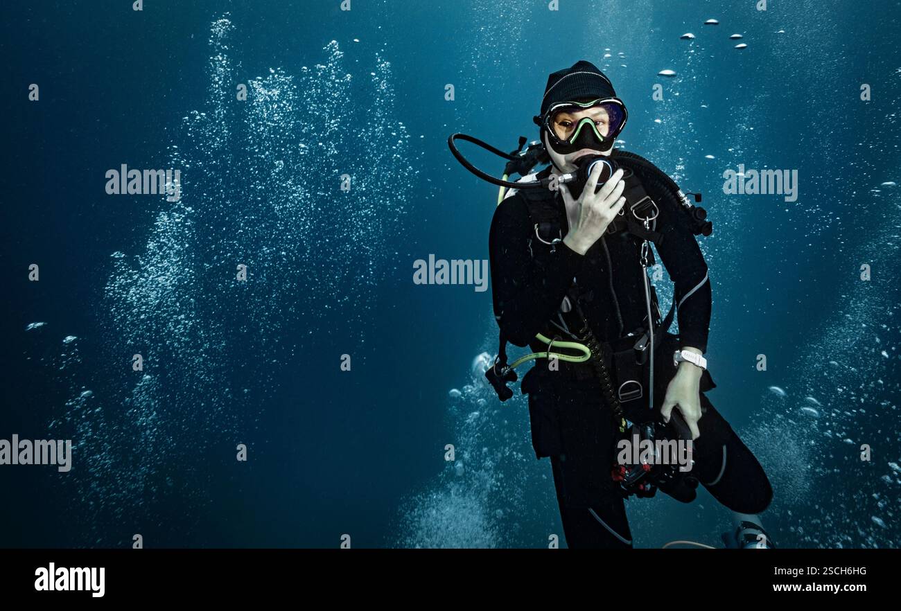 diver ascending from the depth of the ocean in the Maldives Stock Photo ...