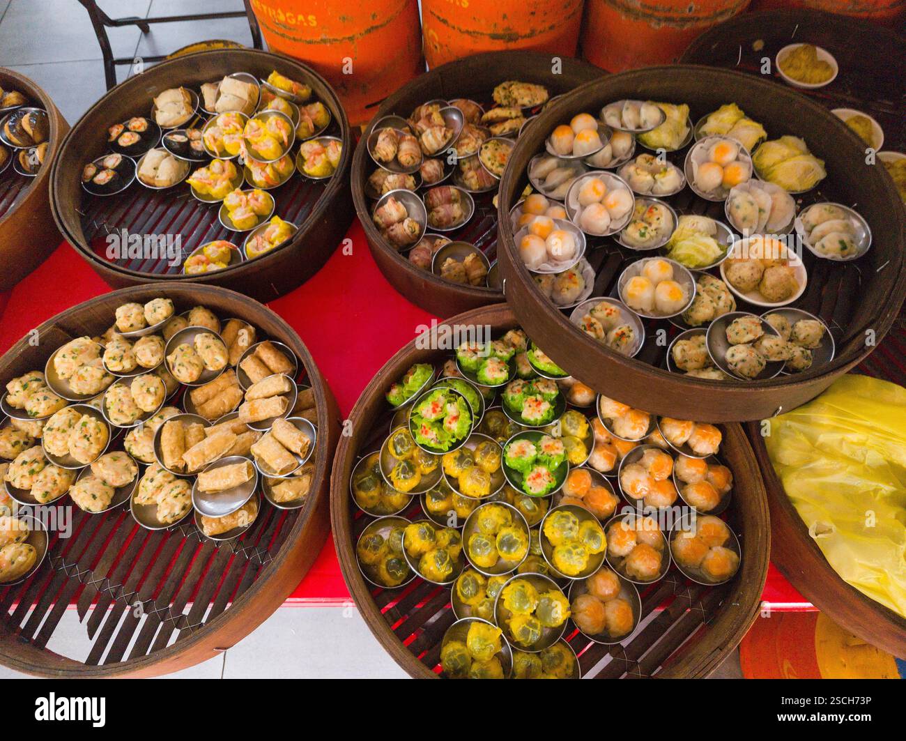 Chinese dim sum delicacies in steamer baskets, varied selections ...