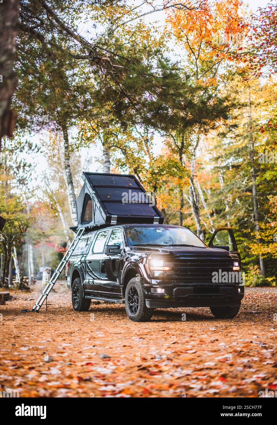 Overlanding truck with roof top tent at campground in Maine in fall Stock Photo - Alamy