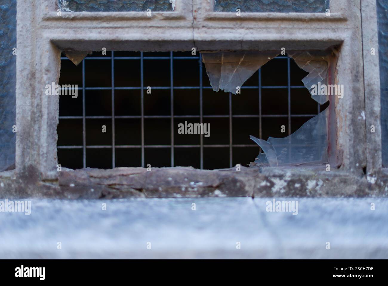 window of abandoned building with broken glass Stock Photo - Alamy