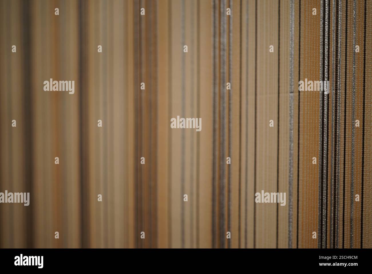 Close-up view of a textured wall with vertical lines made of different ...