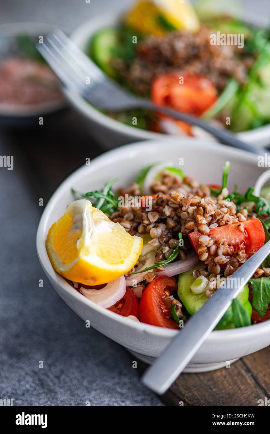 A vibrant healthy lunch made with fresh rocket, chopped oregano, cherry ...