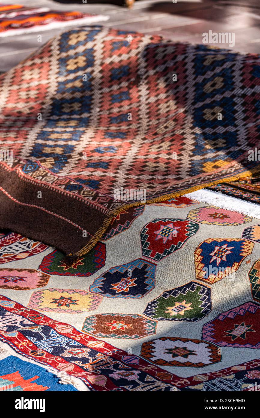 A detailed close-up of colorful Georgian rugs, showcasing their ...