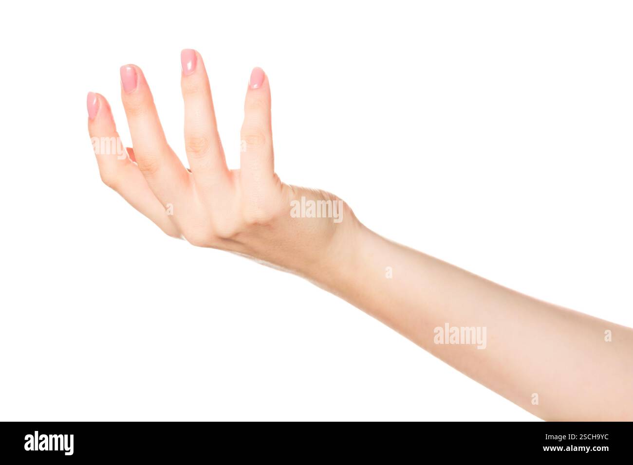 Hand reaching out with elegant fingers against a plain background ...