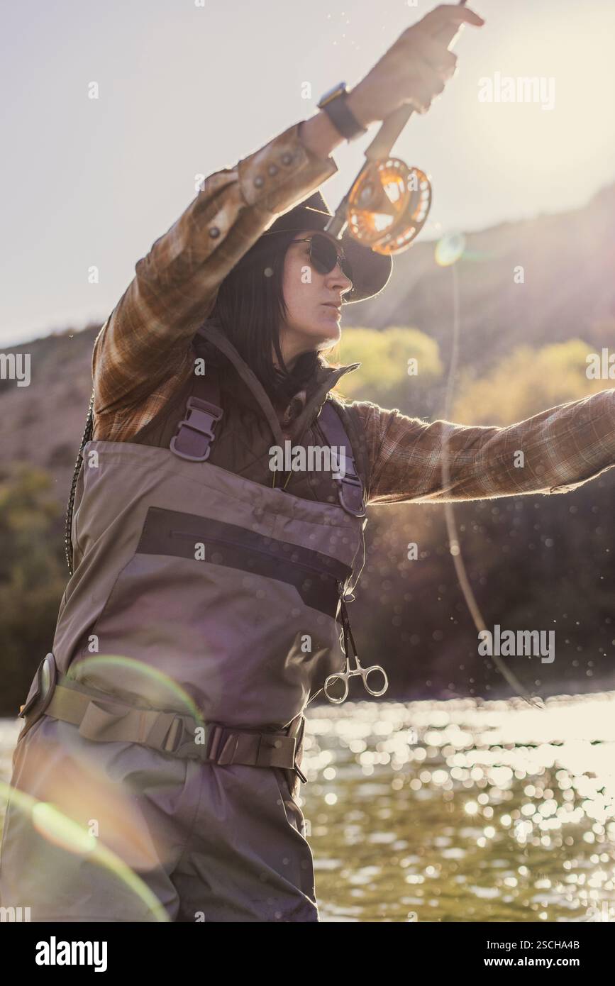 Fly fishing woman euro-nymphing for trout on a river Stock Photo - Alamy