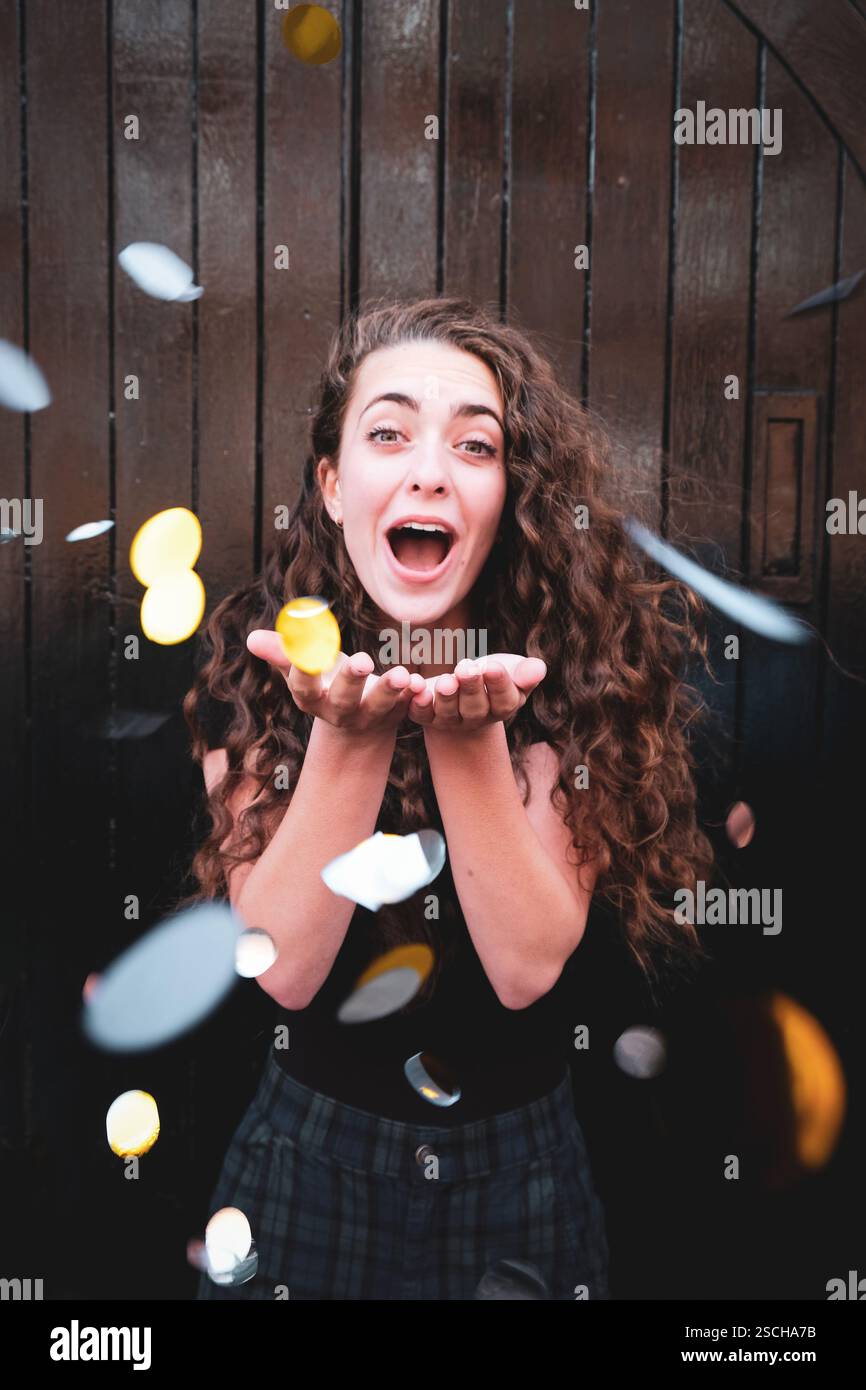 Joyful Girl, Gen Z Blows Gold and Silver Confetti Towards Camera Stock ...