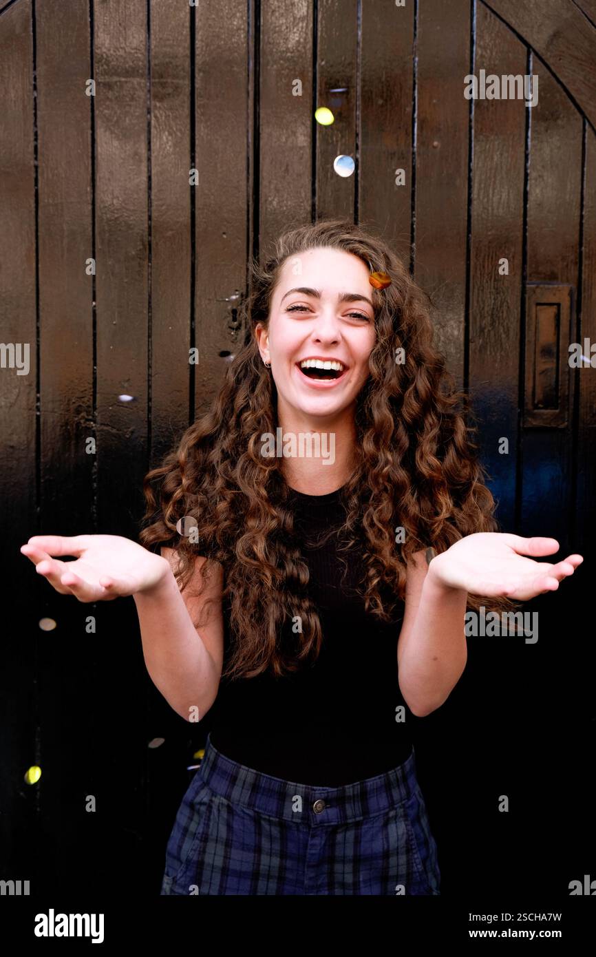 Joyful Girl, Surprise, Gen Z, Gold and Silver Confetti Stock Photo - Alamy