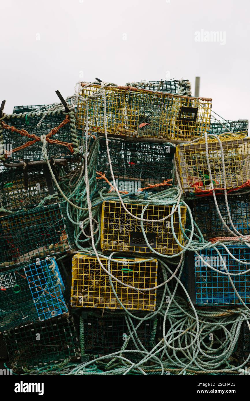 A densely packed arrangement of colorful fishing traps and tangled nets ...