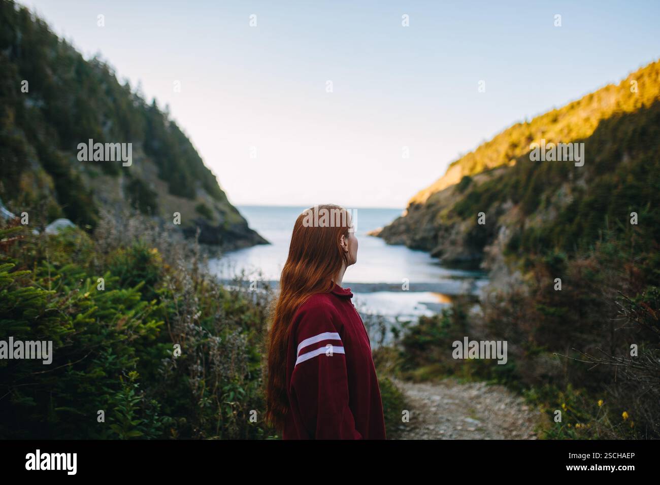 Side view of unrecognizable woman gazing at the serene waters of Shoe ...