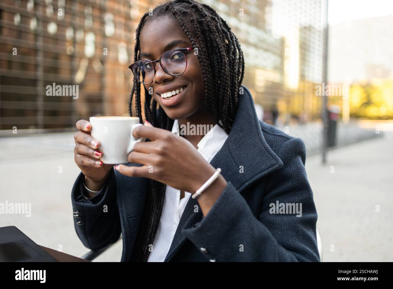 Woman wearing glasses braids hi-res stock photography and images - Alamy