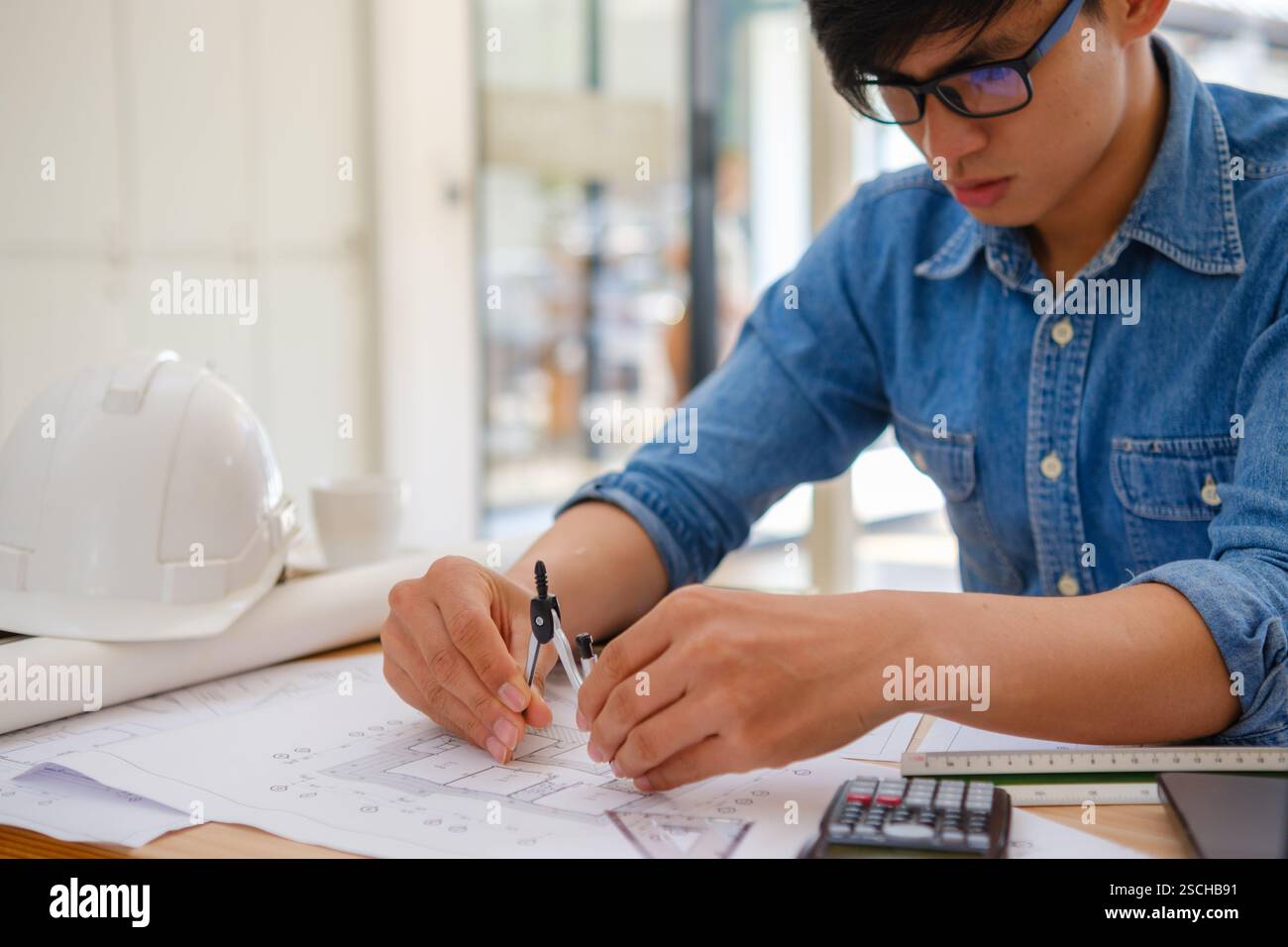 Construction blueprints tools helmet hi-res stock photography and ...