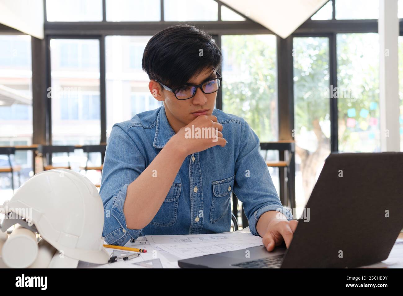 Engineer architect working on blueprints hi-res stock photography and ...