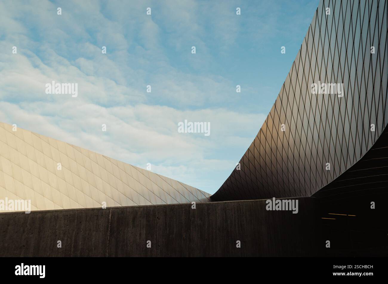 sloped architecture facade with blue sky Stock Photo - Alamy