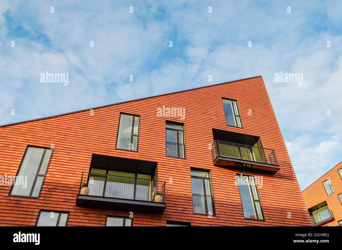 triangular peaked apartment building design Stock Photo - Alamy