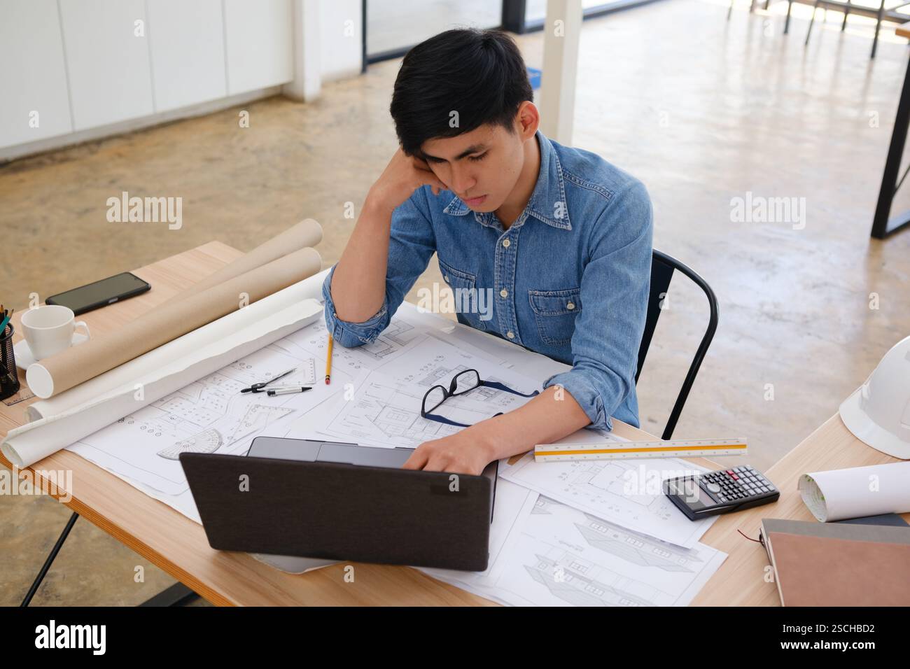 Engineer working laptop blueprints project hi-res stock photography and ...
