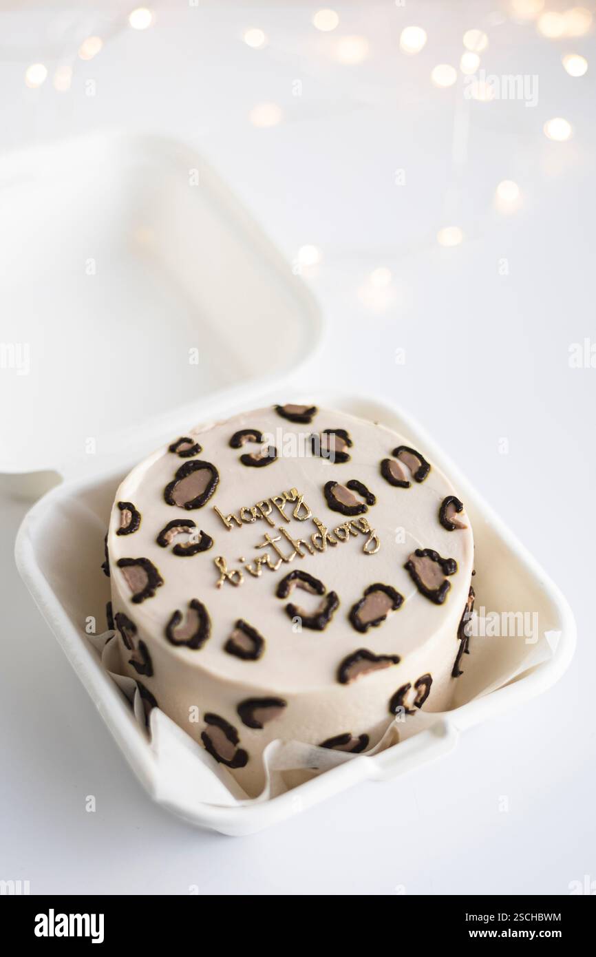 Top view of a stylish leopard print bento cake with Happy Birthday ...