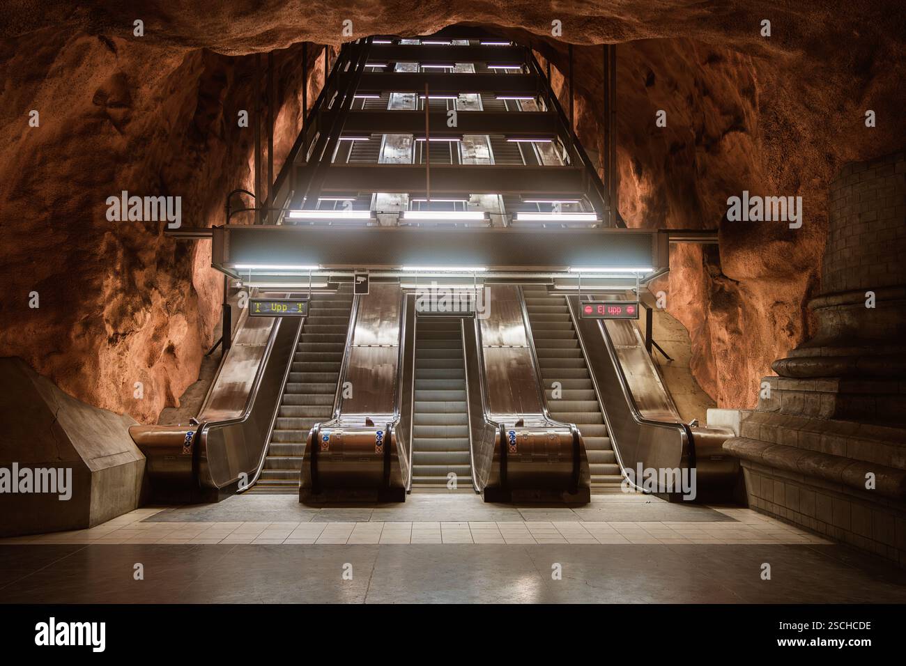 View of escalators at a Stockholm subway station, surrounded by cave ...