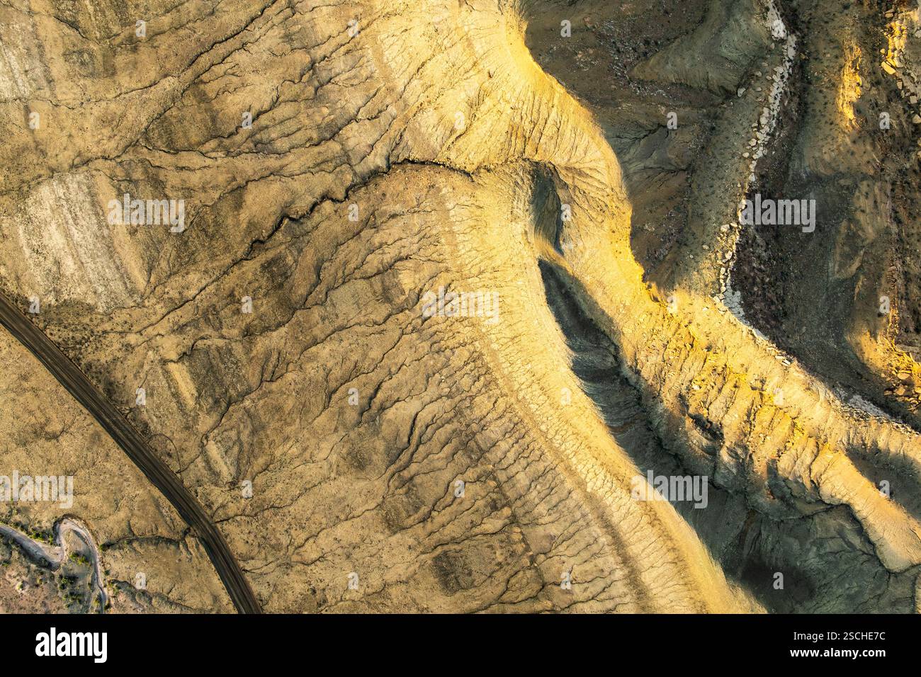 Aerial view of unique golden sandstone patterns in Utah's desert ...
