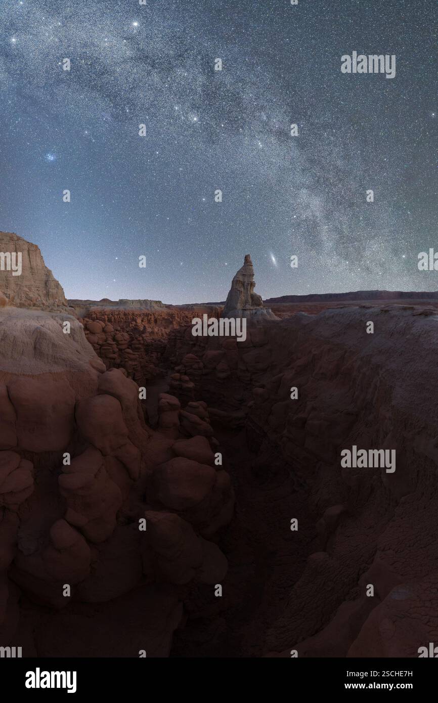 Spectacular view of the Milky Way galaxy over the eerie rock formations ...